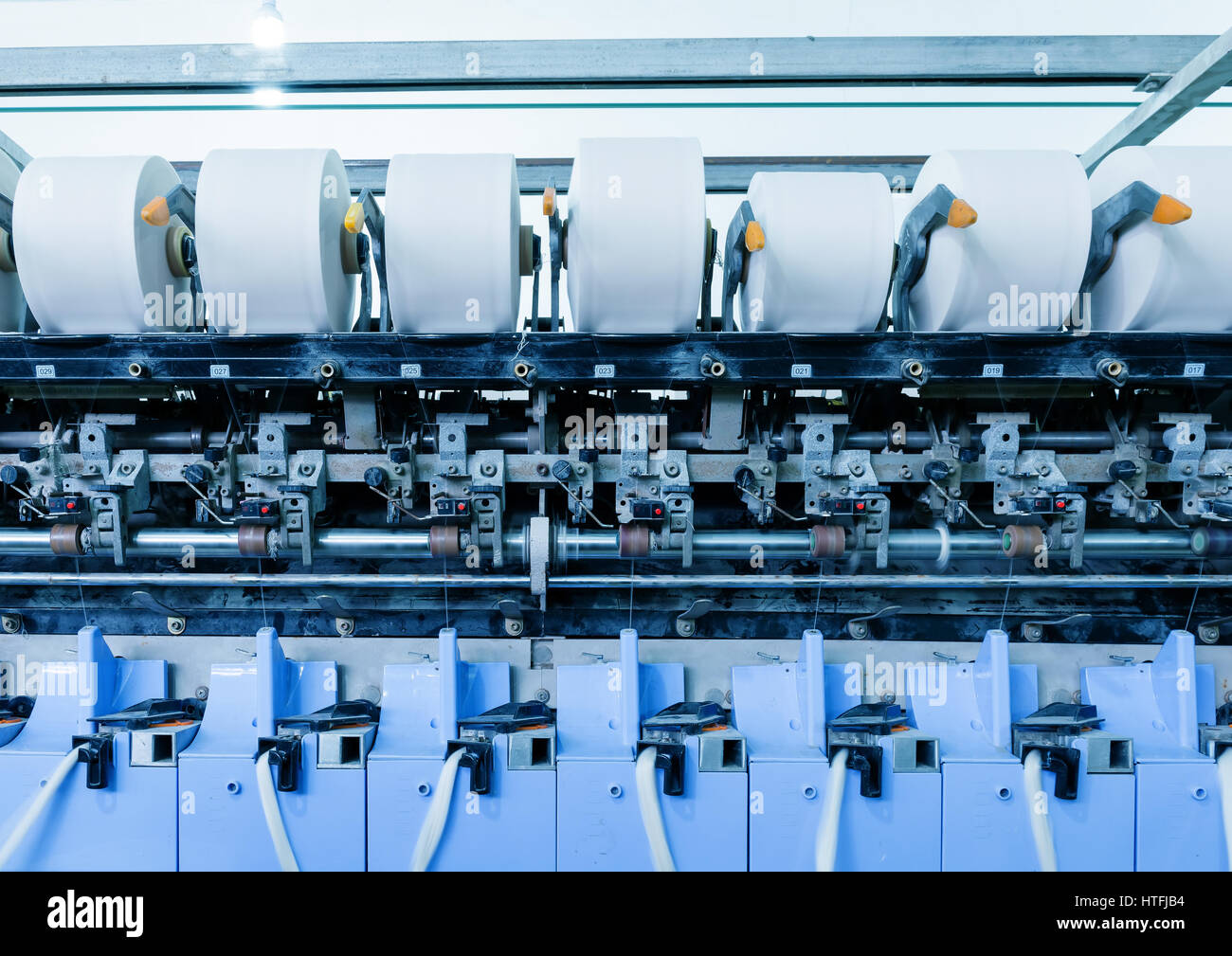 Closeup of machinery part at spinning factory Stock Photo - Alamy
