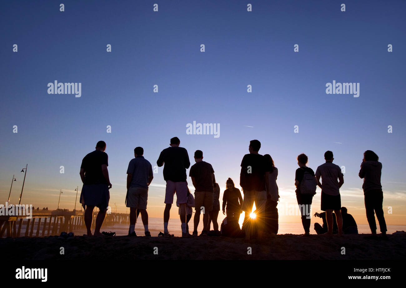 Silhouette group people watching sunset hi-res stock photography and ...