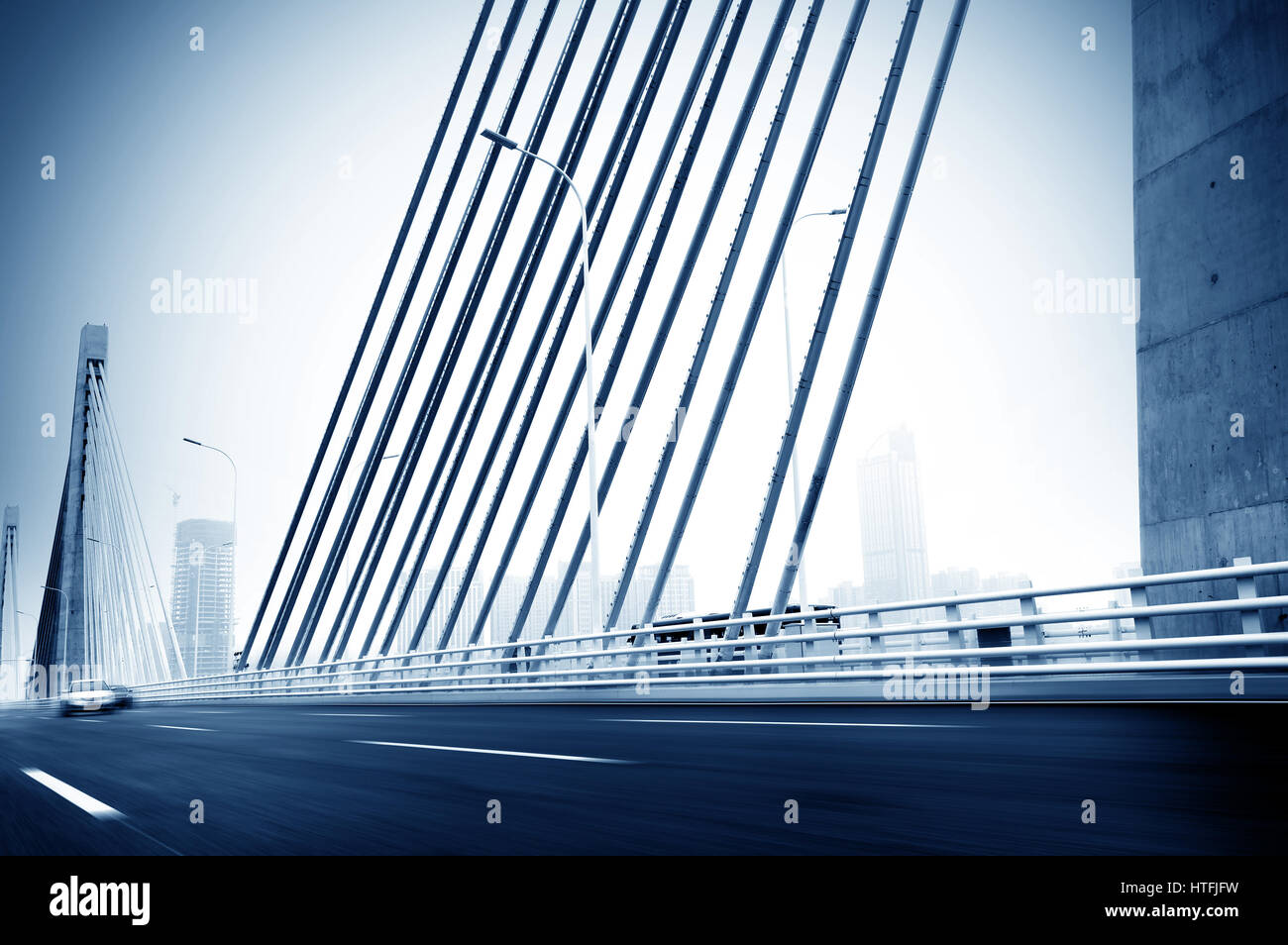 Cars with the modern bridge Stock Photo - Alamy