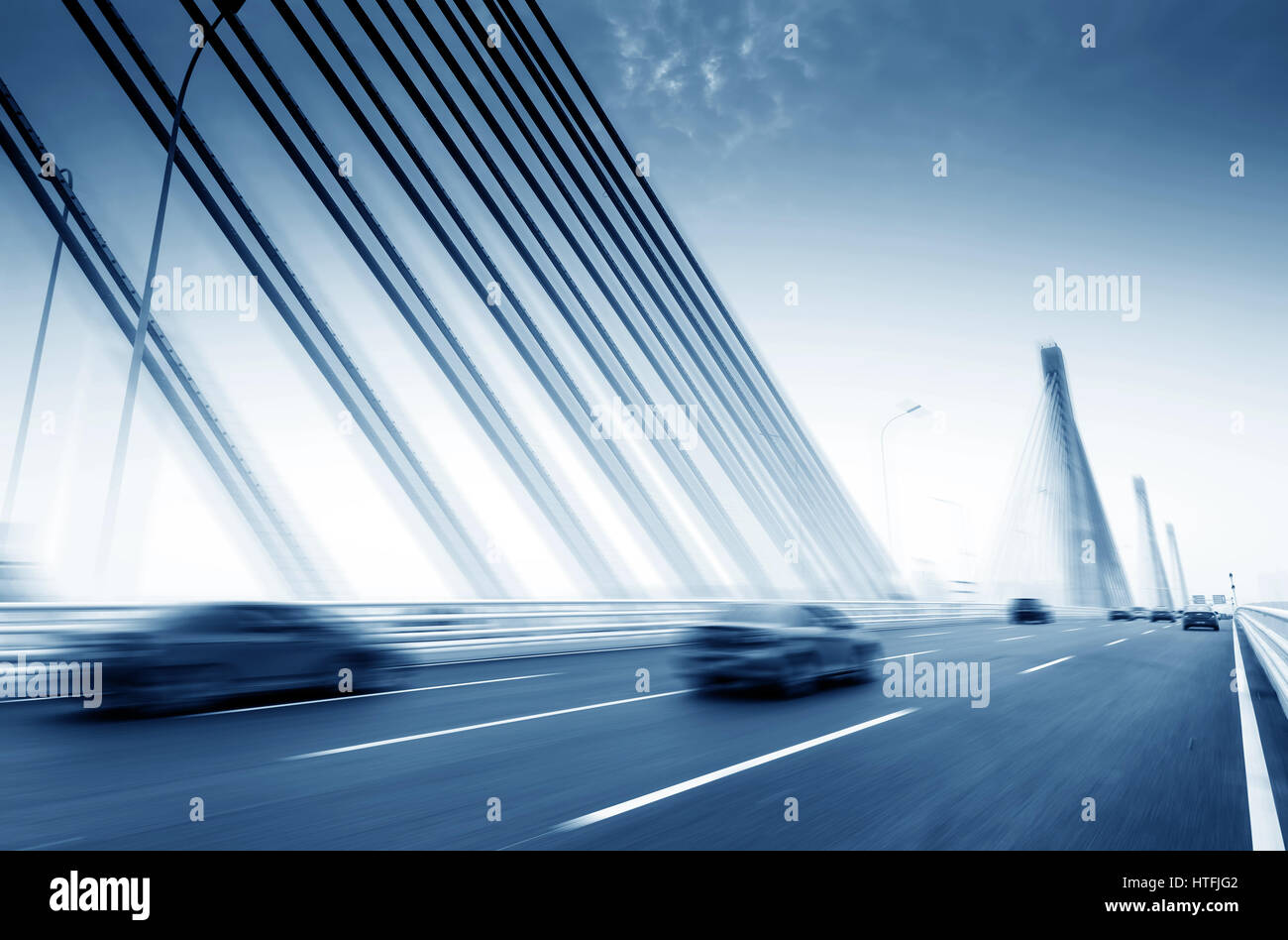 Cars with the modern bridge Stock Photo - Alamy