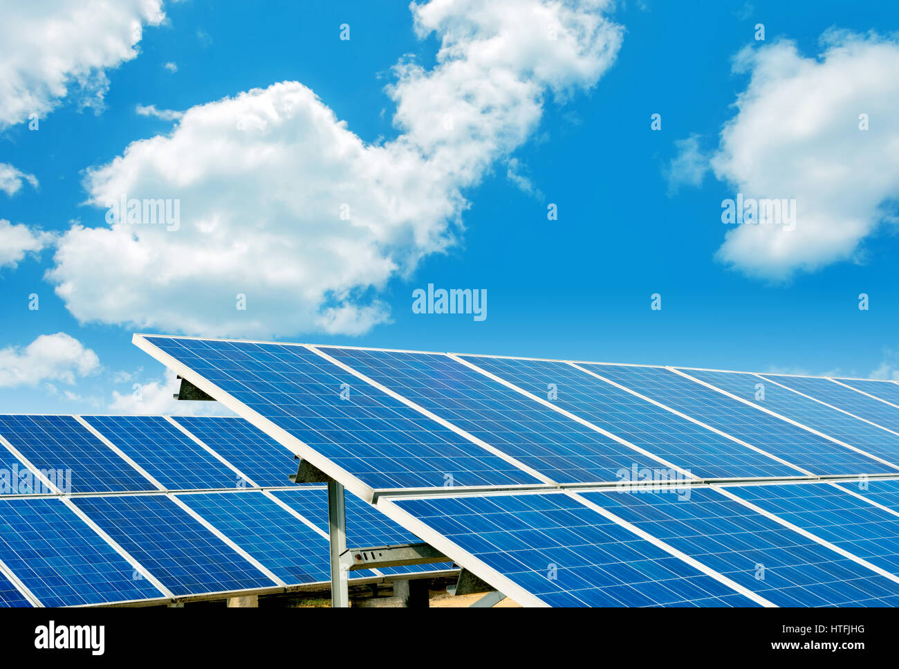 Solar panels against blue sky Stock Photo - Alamy