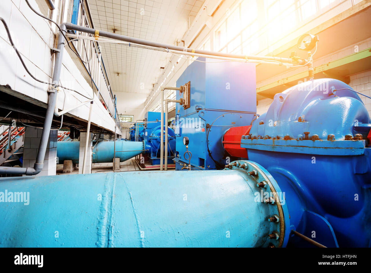 Workshop internal water plant, a large metal pipe Stock Photo - Alamy