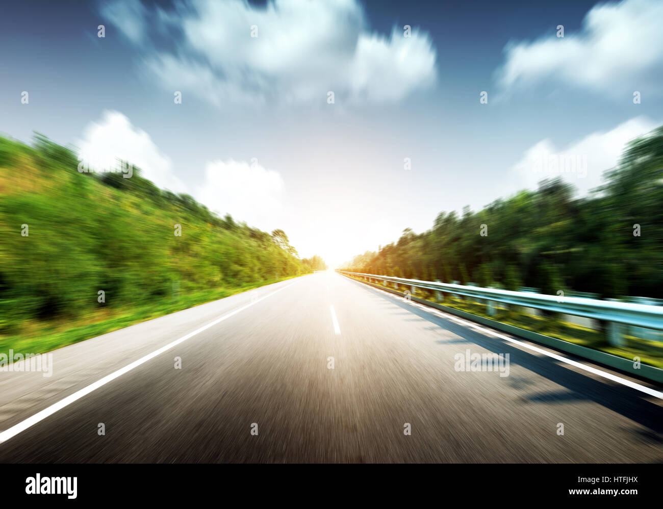 Highway under the blue sky Stock Photo - Alamy