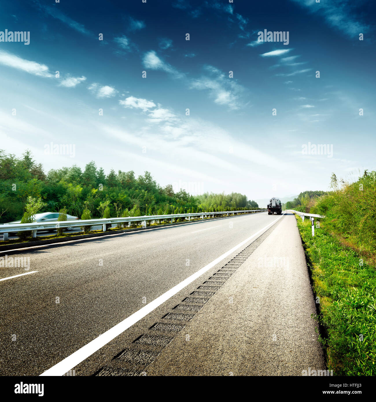 Highway under the blue sky Stock Photo - Alamy