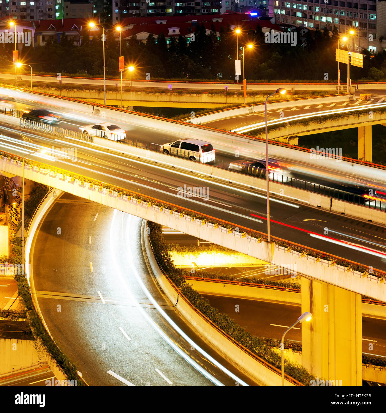 Freeway in night with cars light in modern city Stock Photo - Alamy