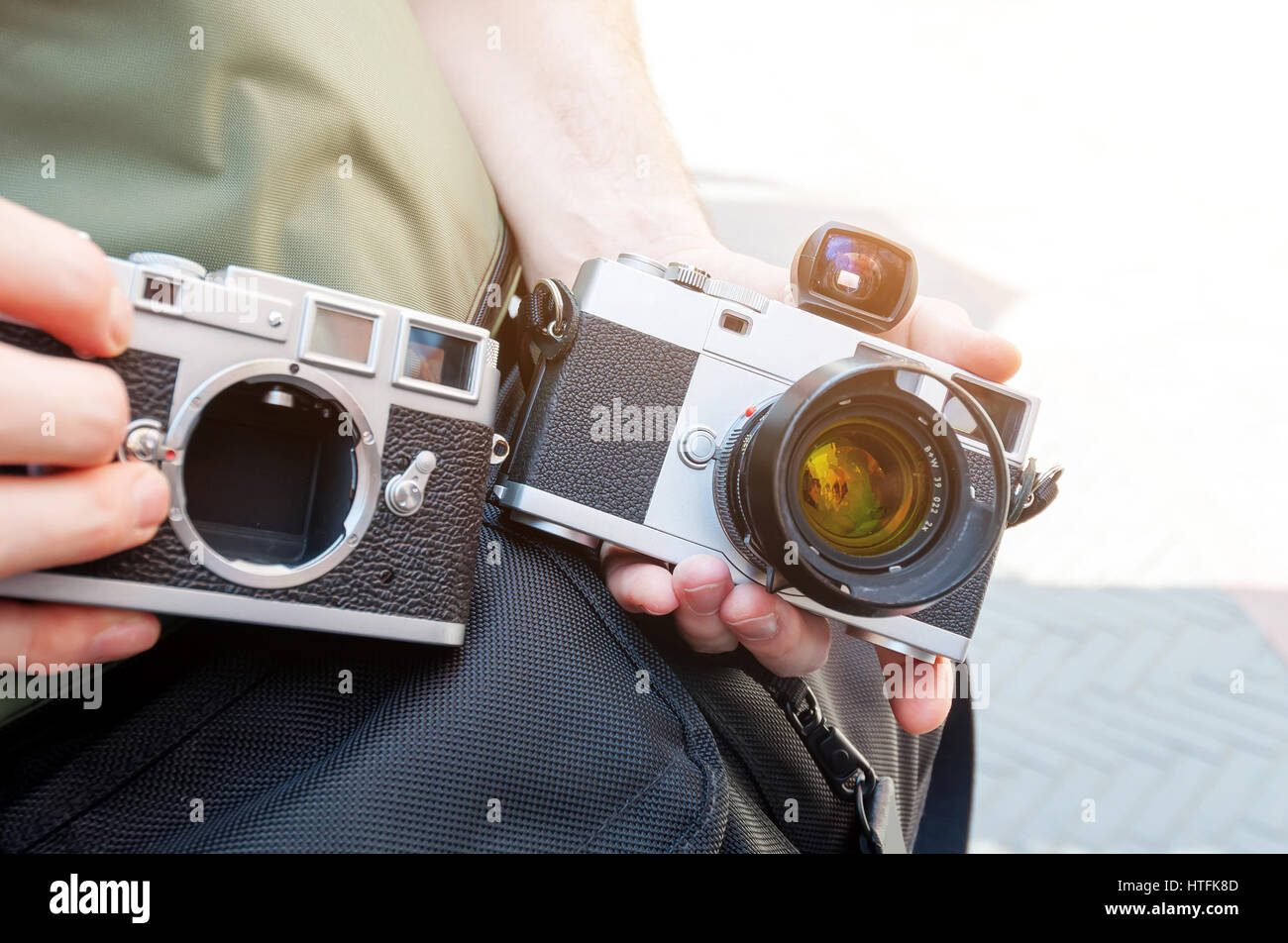 Two older men show a film camera Stock Photo - Alamy
