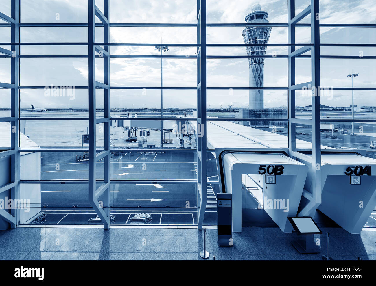 A passenger plane being serviced by ground services before next takeoff ...