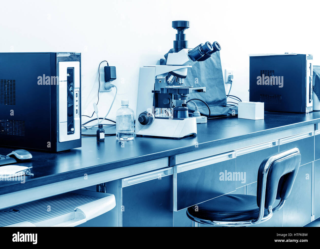 Microscope isolated against white background Stock Photo - Alamy