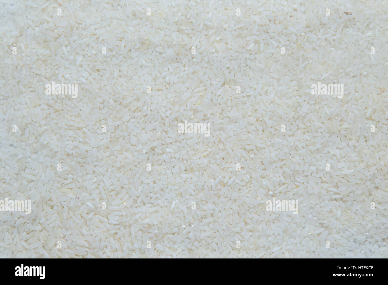 Uncooked white rice closeup , background Stock Photo - Alamy