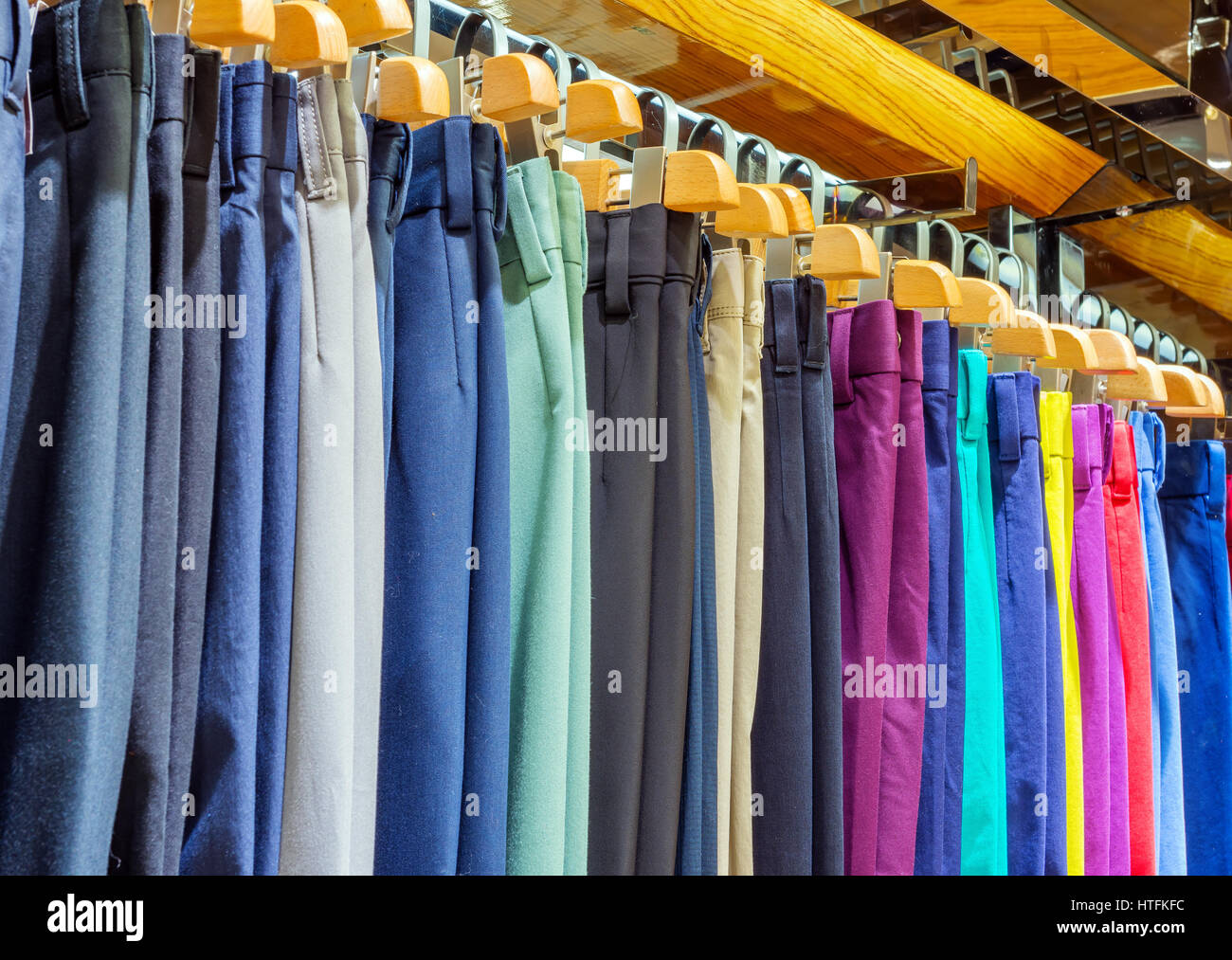 Wardrobe mall, hanging colorful pants Stock Photo - Alamy