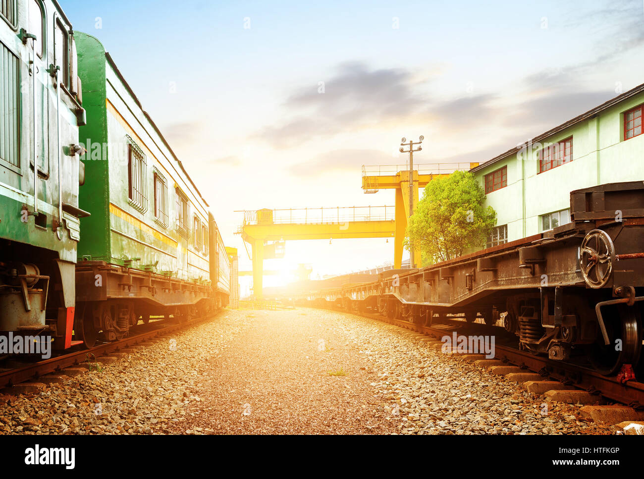 Train passing by in orange sunset Stock Photo - Alamy