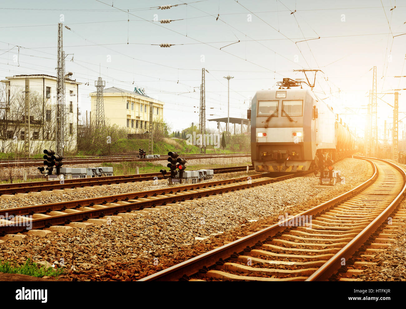 Train passing by in orange sunset Stock Photo - Alamy