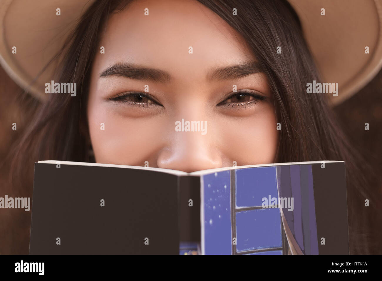 Beautiful girl holding open book hi-res stock photography and images ...