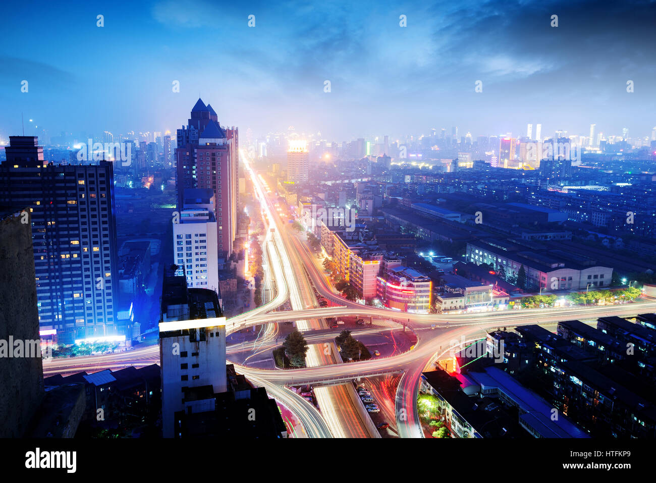 Freeway in night with cars light in modern city Stock Photo - Alamy