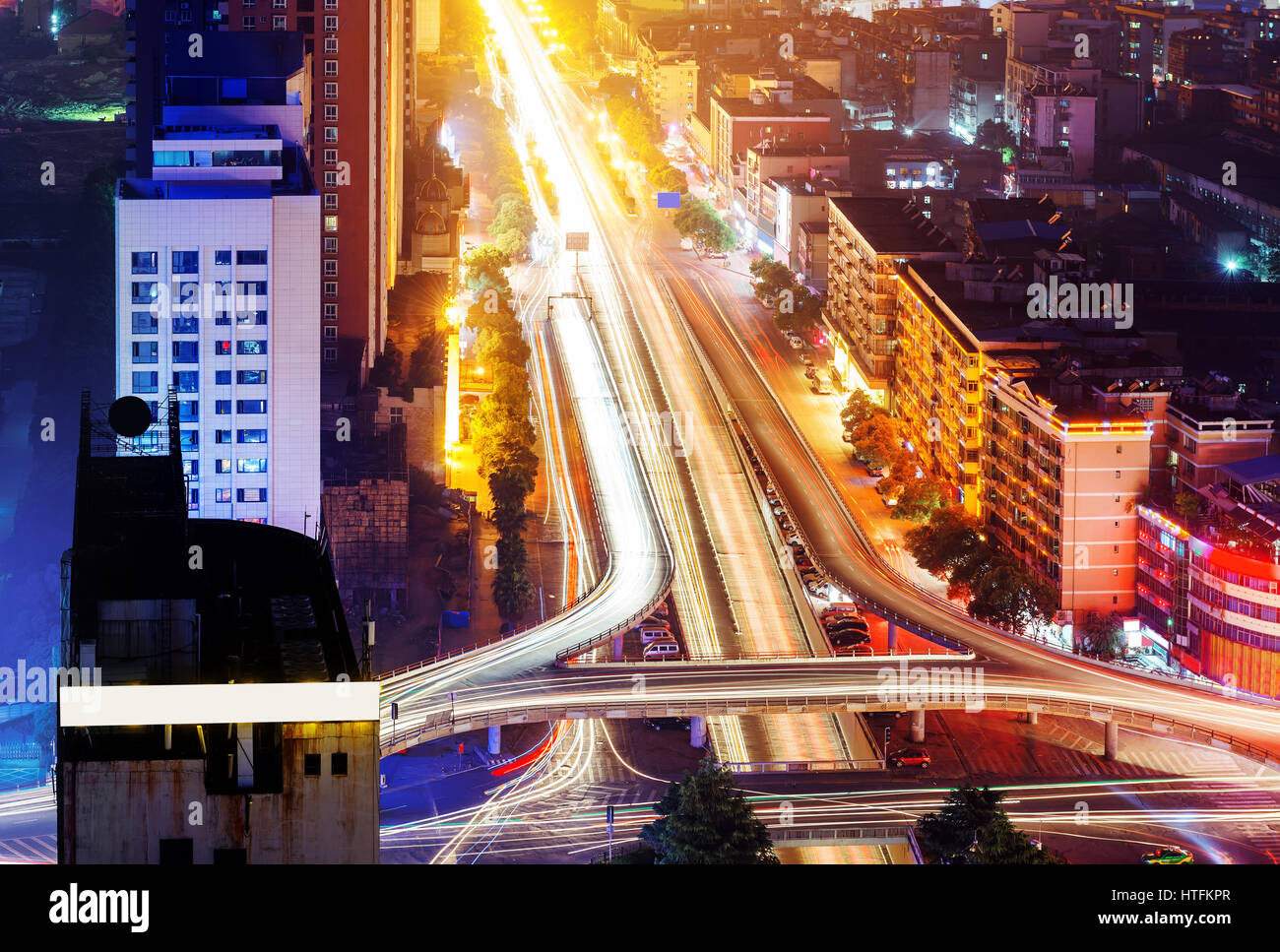 Freeway in night with cars light in modern city Stock Photo - Alamy