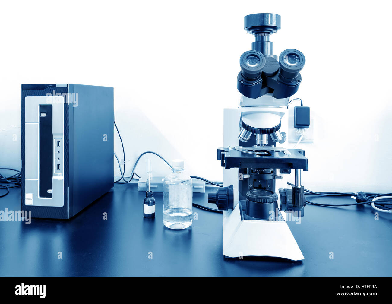 Microscope isolated against white background Stock Photo - Alamy