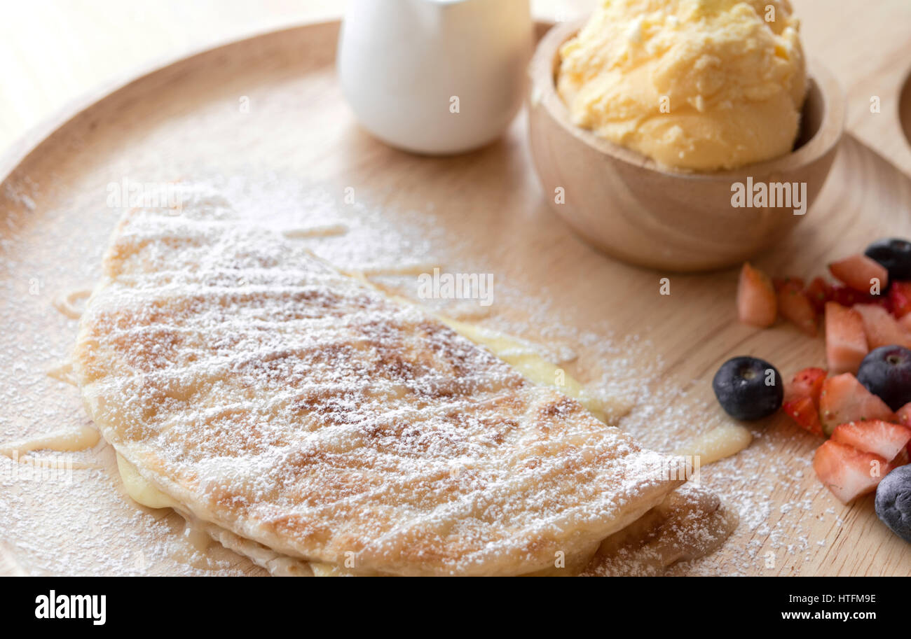 fresh dessert soft vanila roti with ice cream ,syrup ,strawberry and ...
