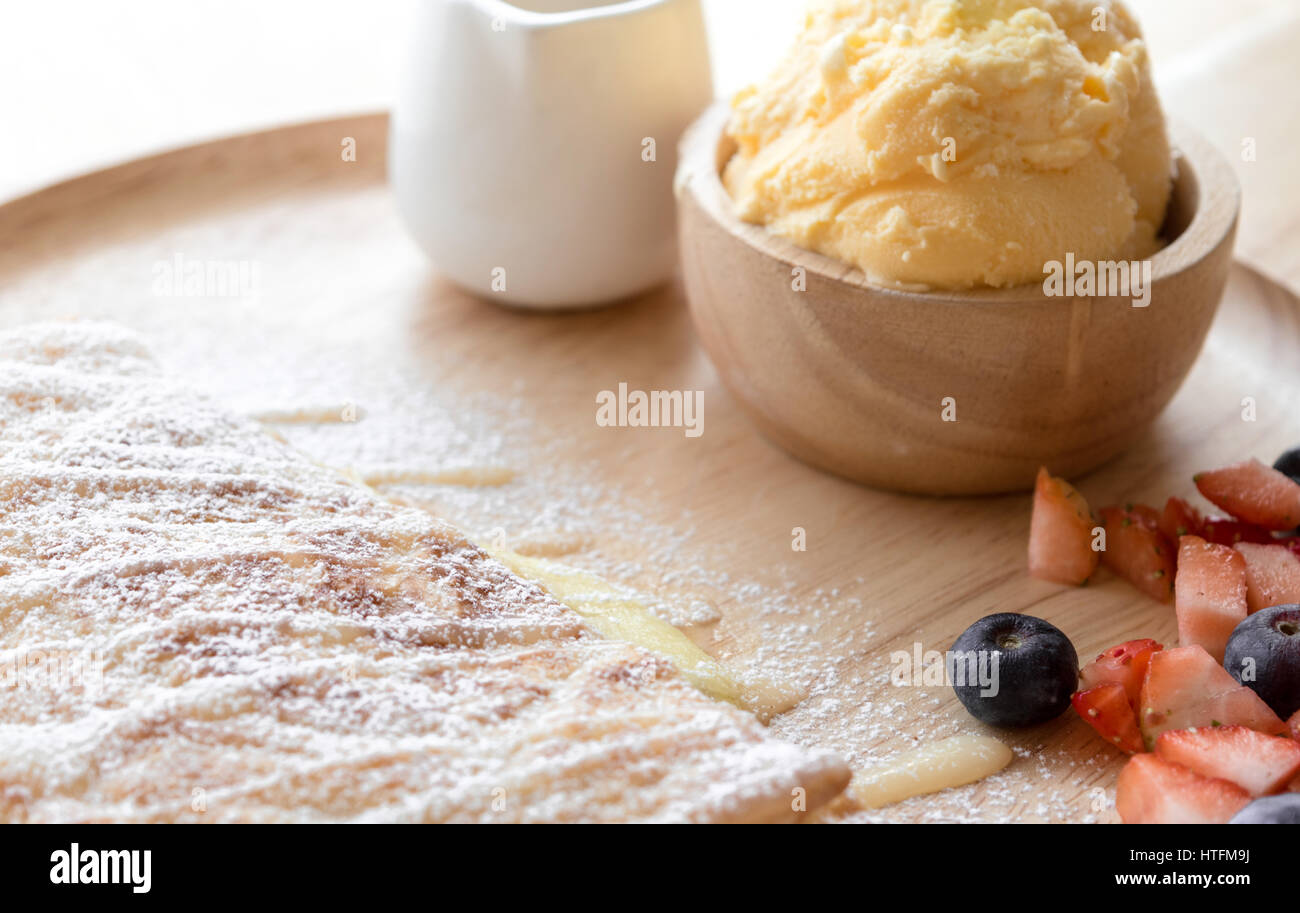 fresh dessert soft vanila roti with ice cream ,syrup ,strawberry and ...