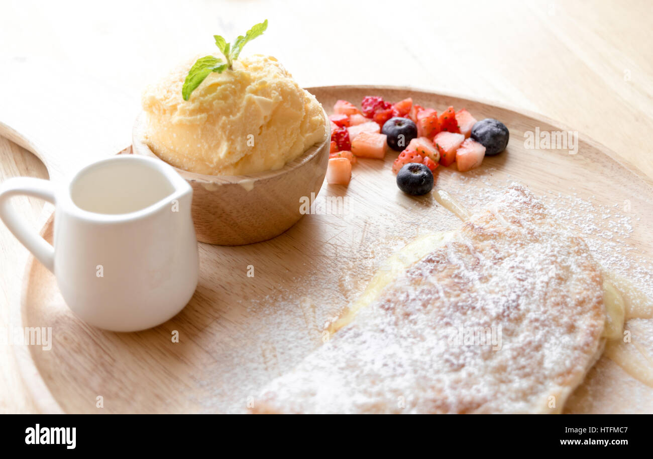 fresh dessert soft vanila roti with ice cream ,syrup ,strawberry and ...