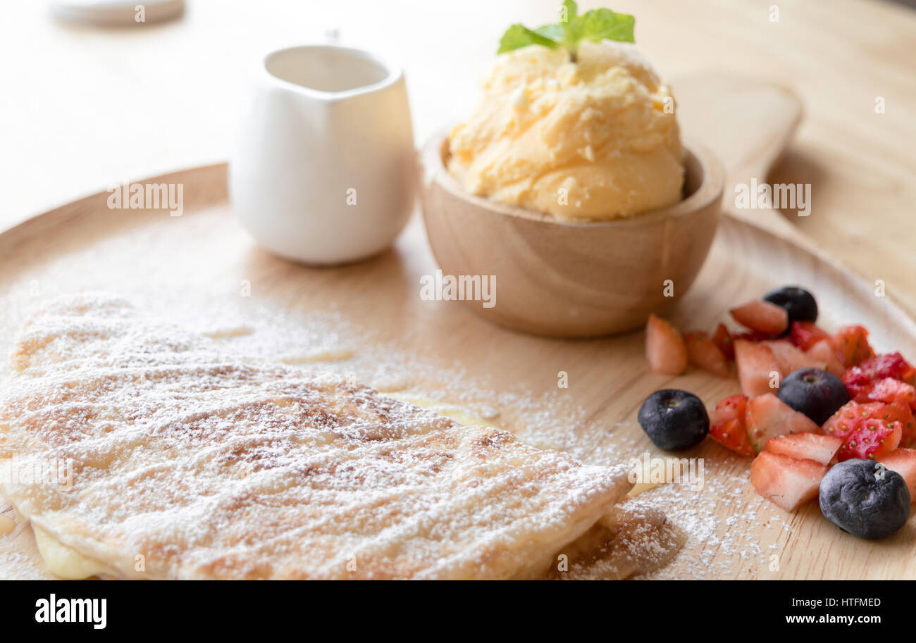 fresh dessert soft vanila roti with ice cream ,syrup ,strawberry and ...