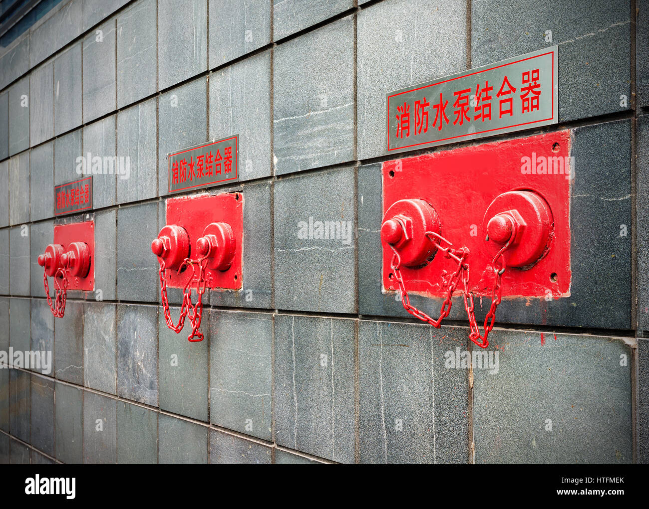 Fire pump adapter on the building wall Stock Photo - Alamy