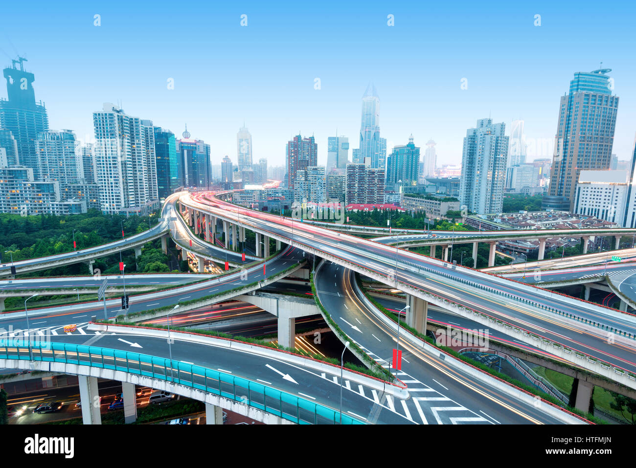 Freeway in night with cars light in modern city Stock Photo - Alamy