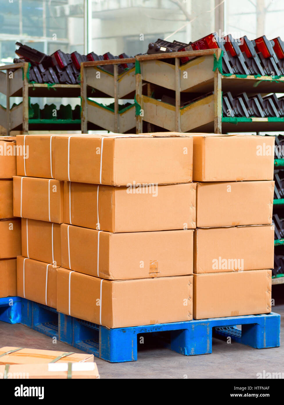 Factory warehouse, some shelves and a pile of cardboard boxes Stock ...