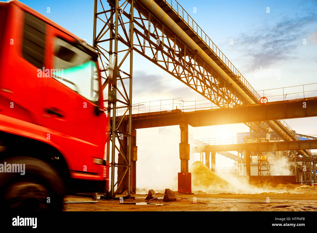 Steelworks pipes and trucks, twilight landscape Stock Photo - Alamy