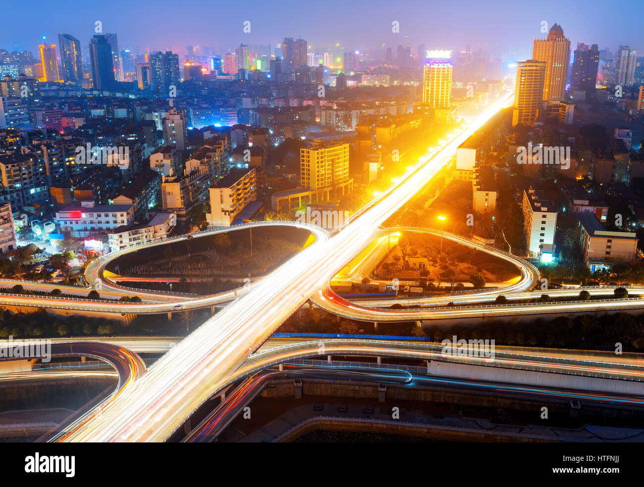 Freeway in night with cars light in modern city Stock Photo - Alamy