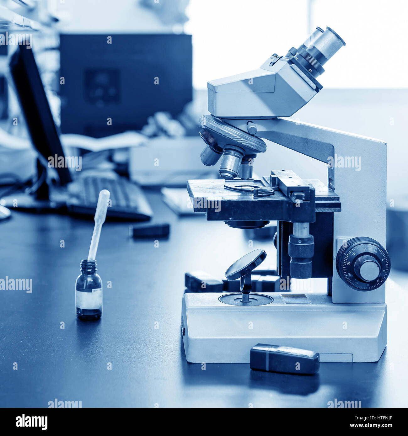Microscope isolated against white background Stock Photo - Alamy
