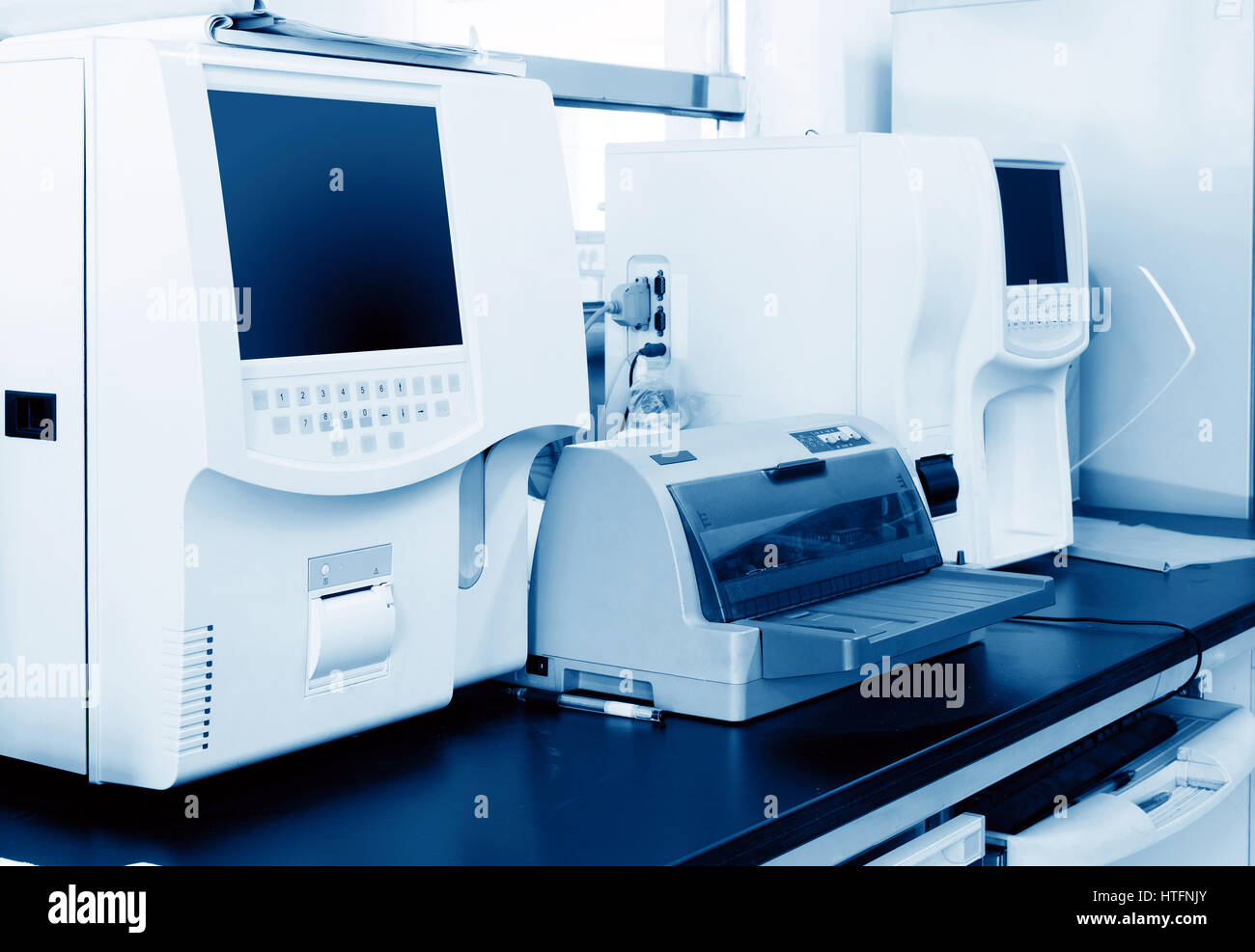 Test equipment and printers hospital Stock Photo - Alamy
