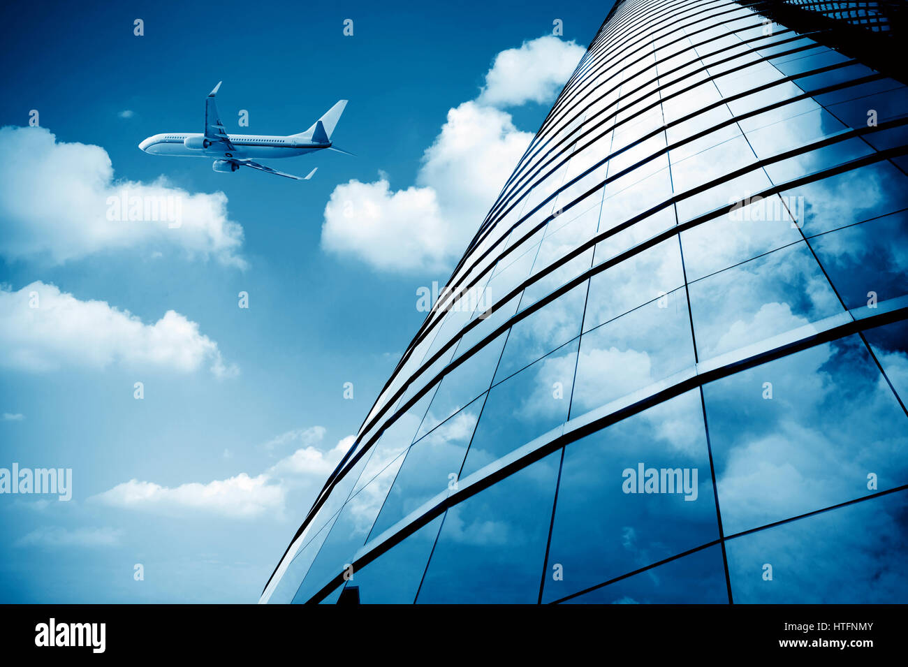 glass curtain wall and aircraft against a blue sky Stock Photo - Alamy