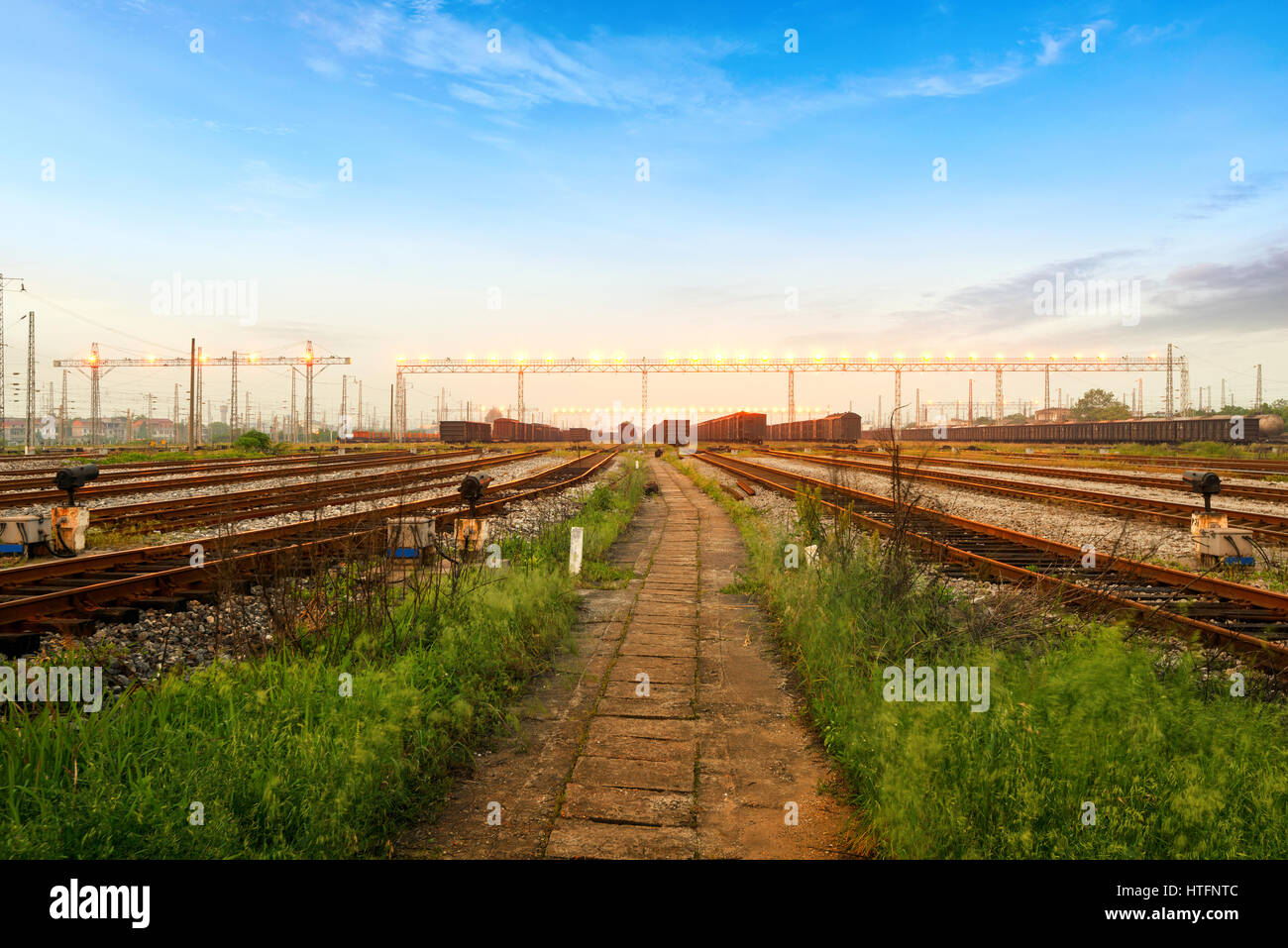 Cargo train platform at sunset with container Stock Photo - Alamy