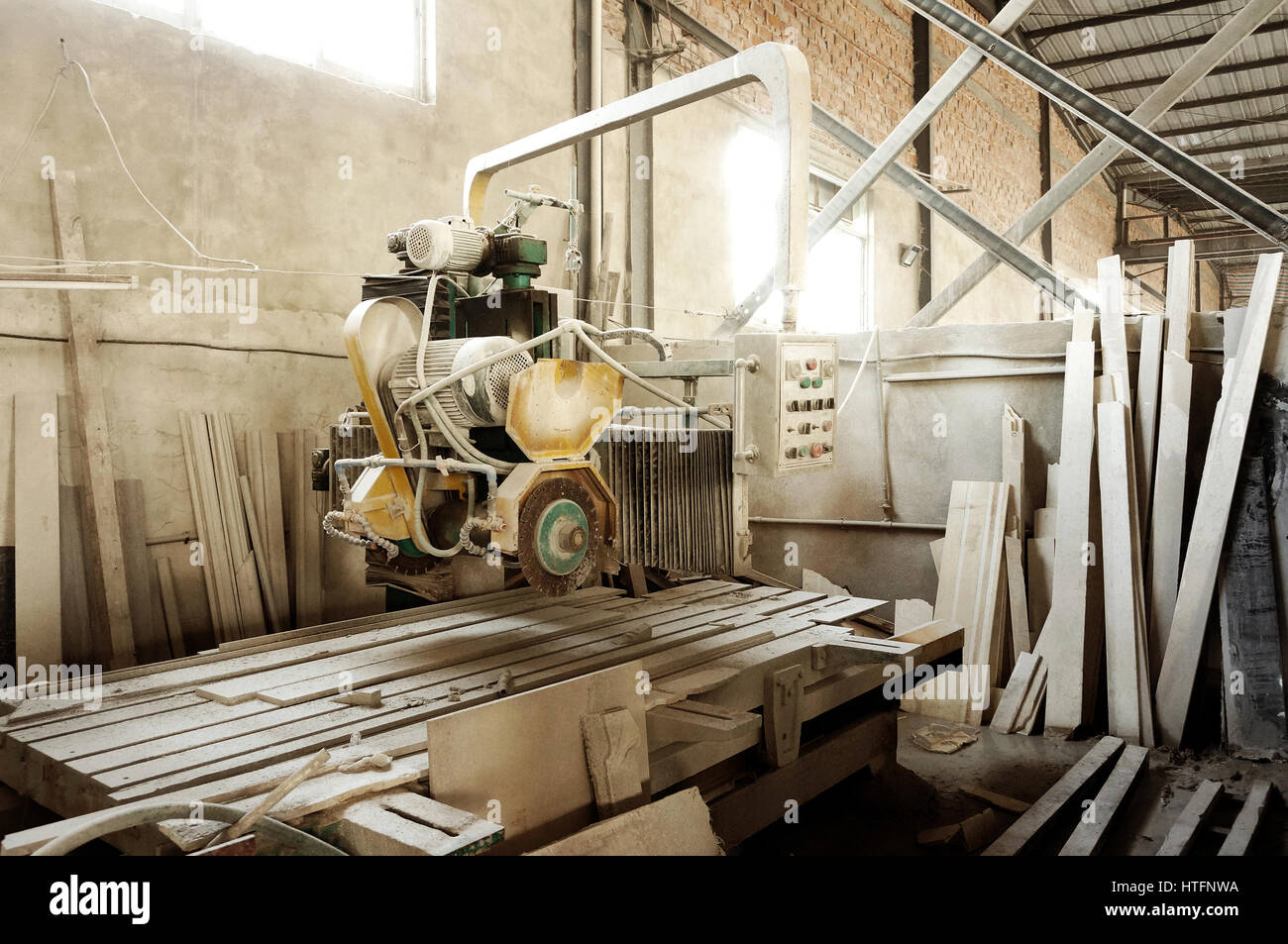 Inside the stone cutting machine factoryga Stock Photo - Alamy