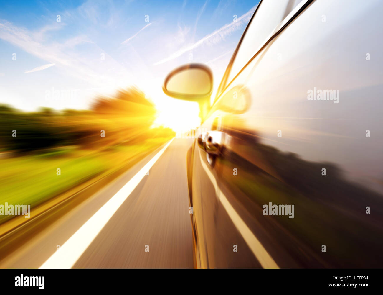 A car driving on a motorway at high speeds, overtaking other cars Stock ...