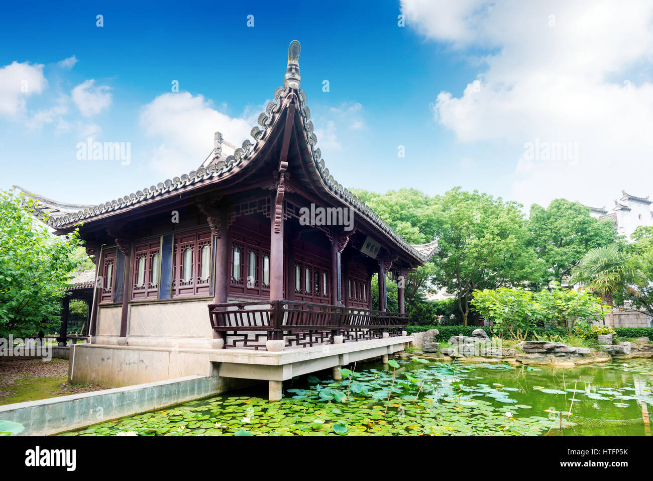 Traditional Chinese ancient buildings, a pond and duckweed Stock Photo ...