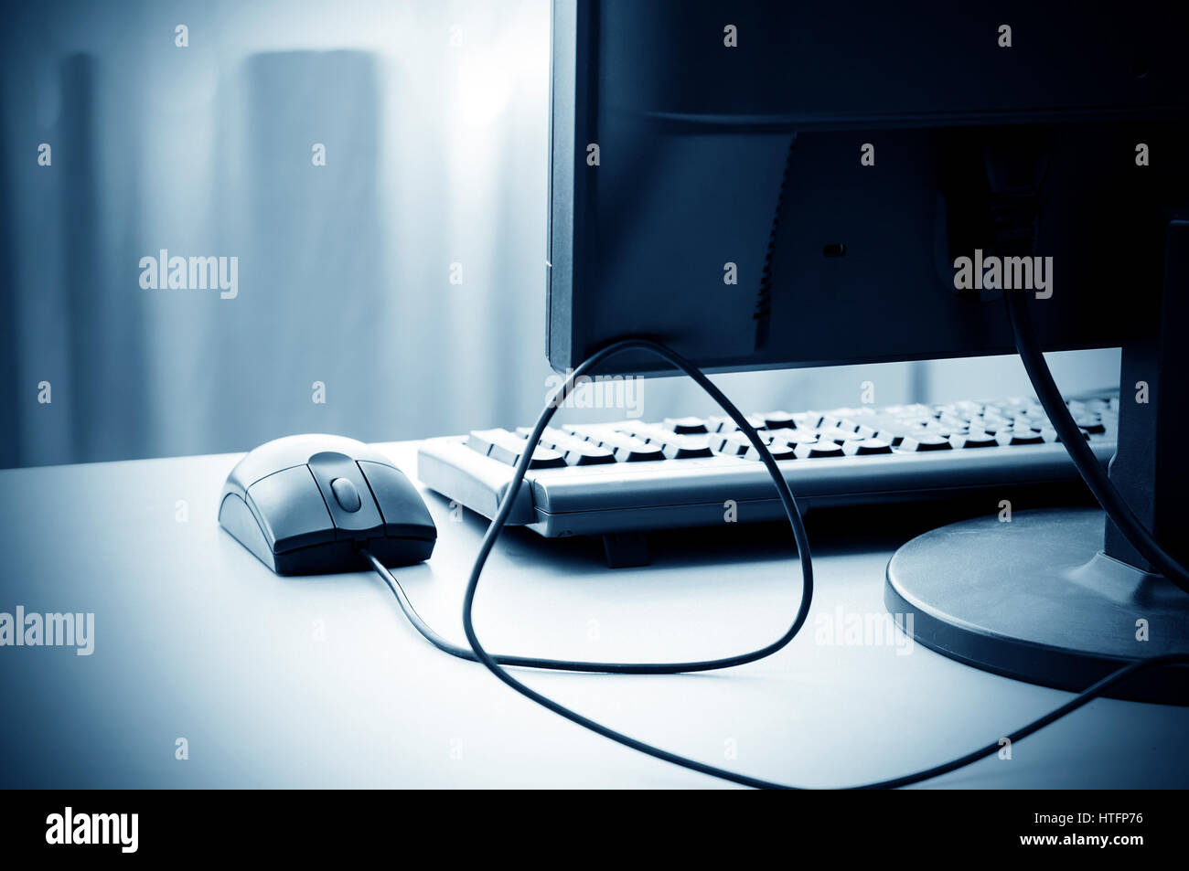 Room inside the computer and the mouse close-up, blue tint Stock Photo ...