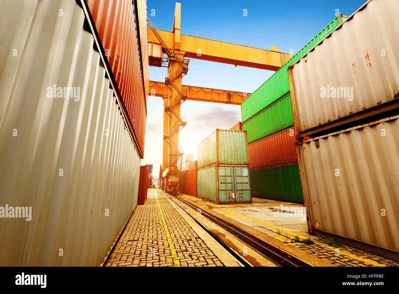 Port of containers and cranes, dock dusk landscape Stock Photo - Alamy