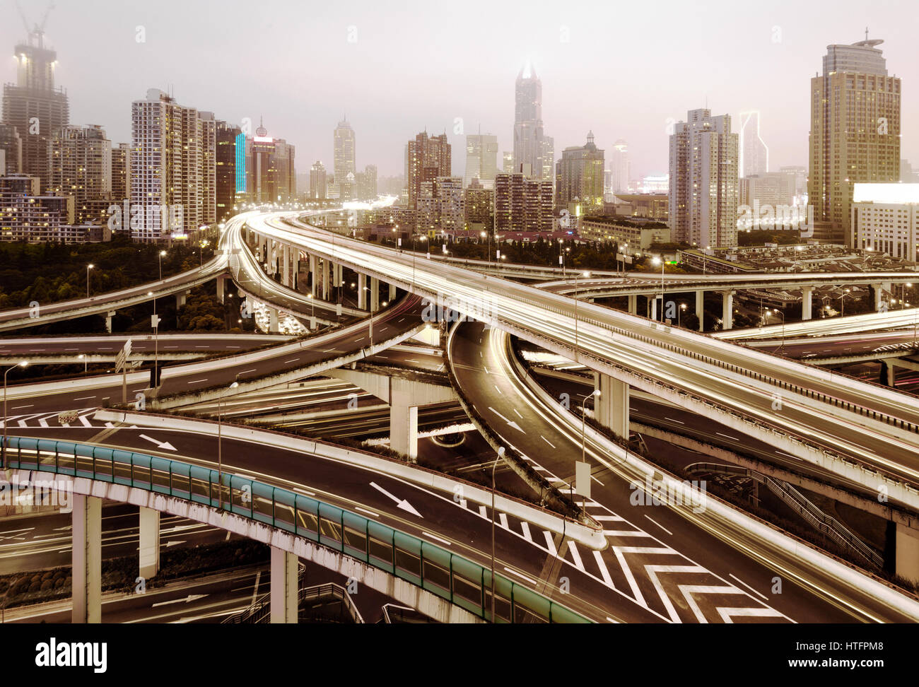 Freeway in night with cars light in modern city Stock Photo - Alamy