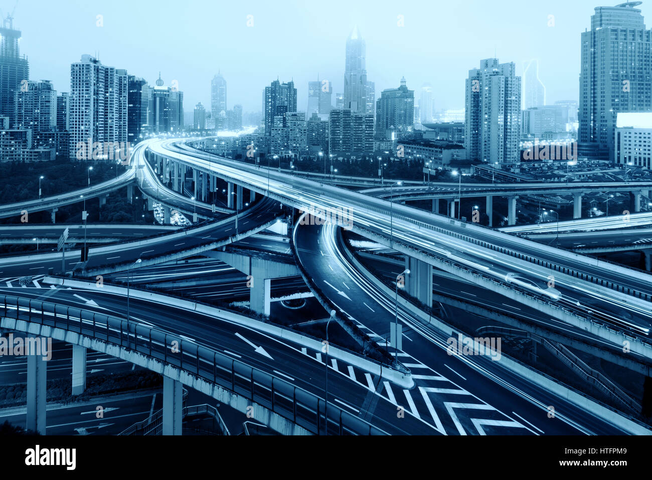 Freeway in night with cars light in modern city Stock Photo - Alamy