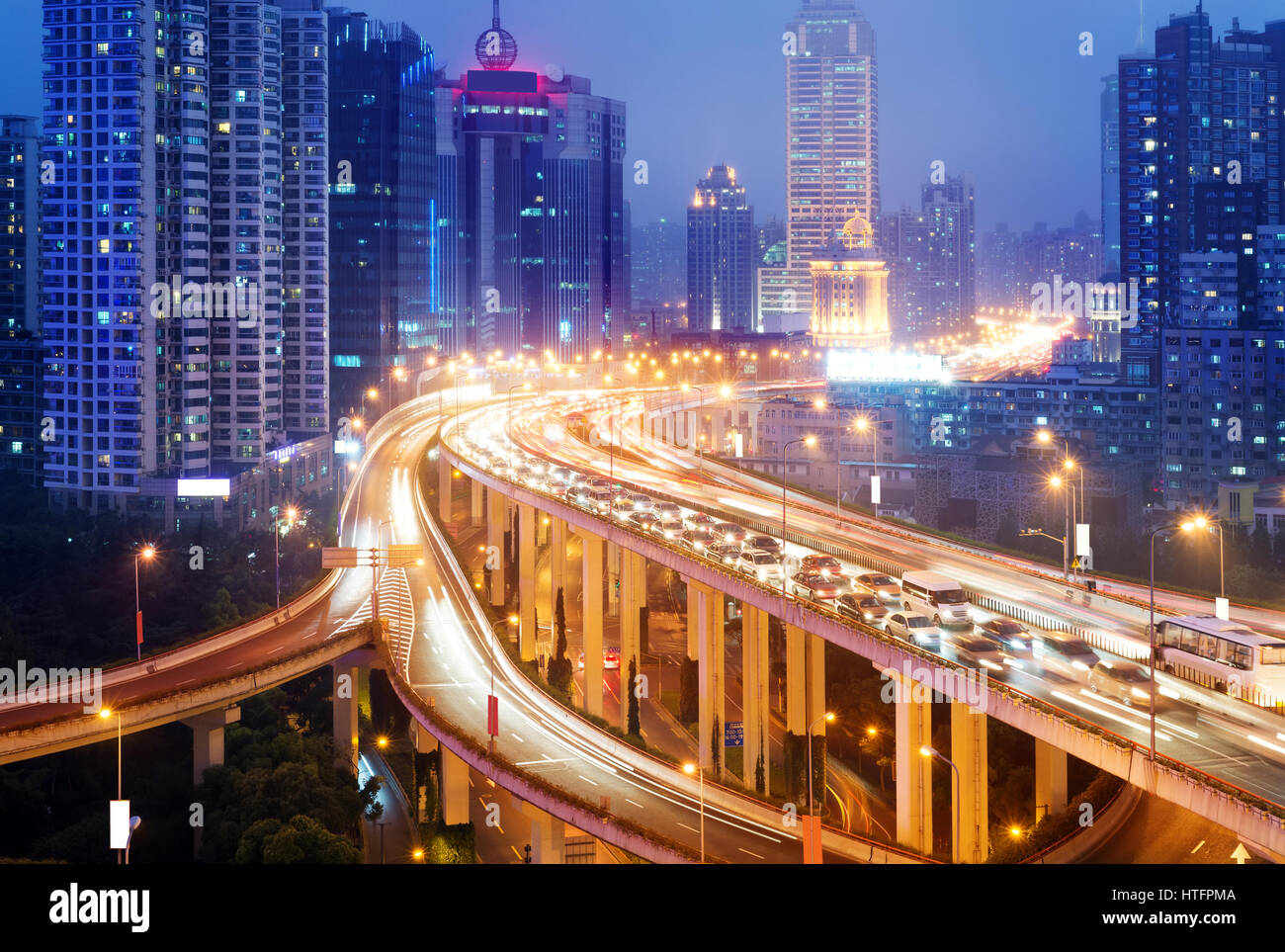 Freeway in night with cars light in modern city Stock Photo - Alamy