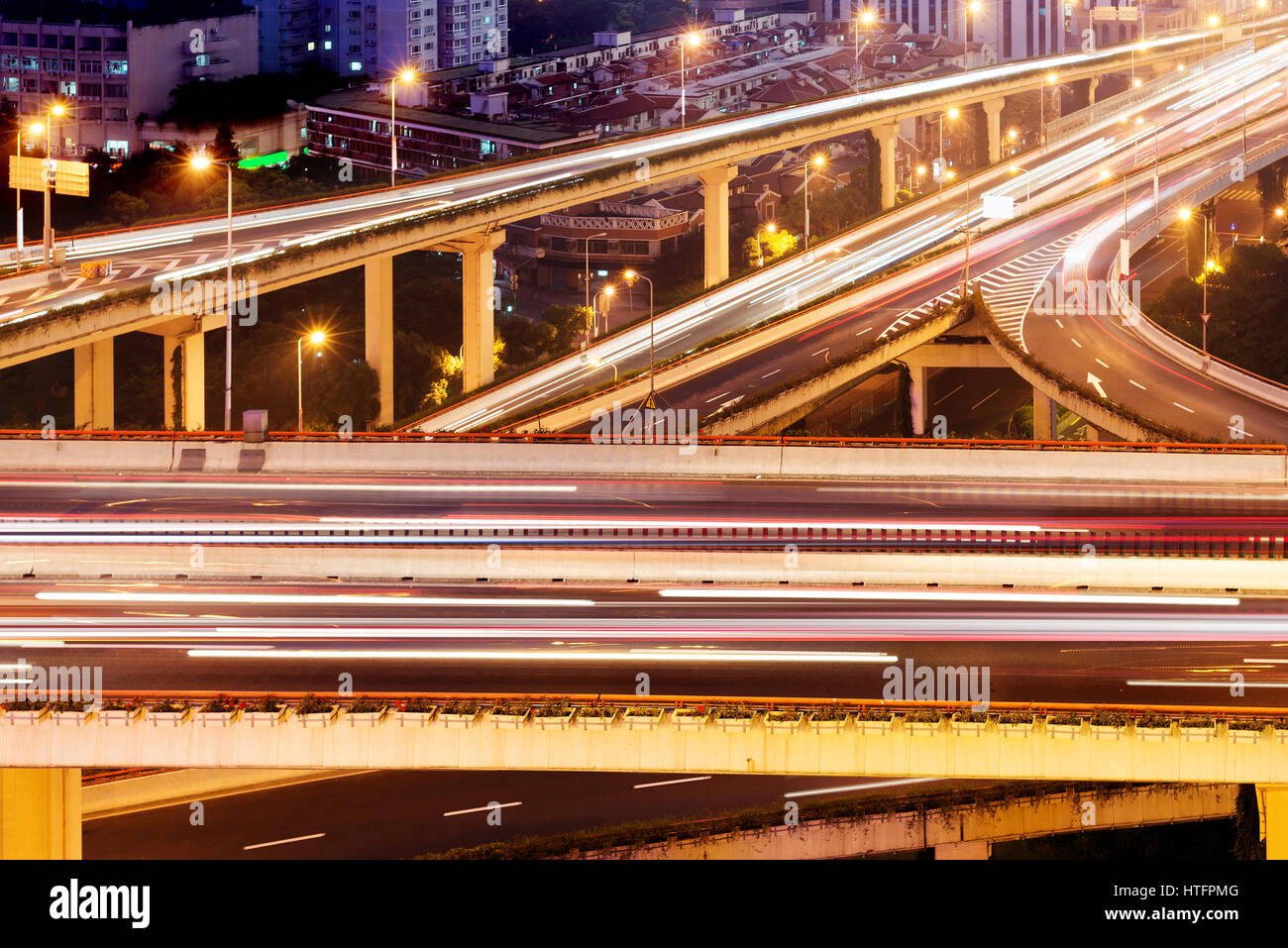 Freeway in night with cars light in modern city Stock Photo - Alamy