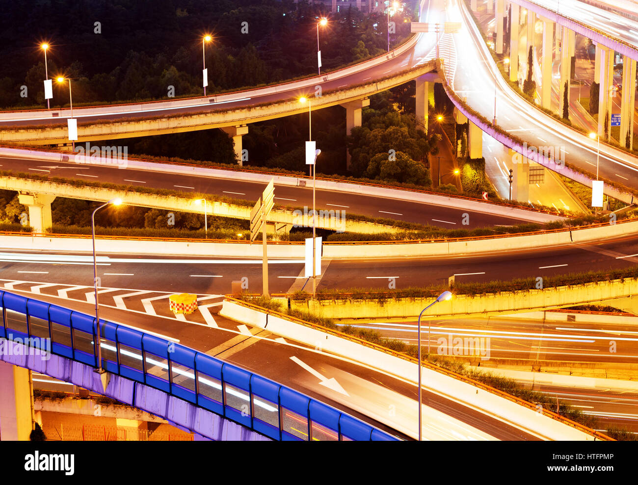 Freeway in night with cars light in modern city Stock Photo - Alamy