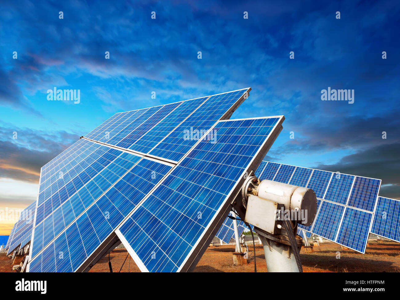 Solar energy panels in the setting sun Stock Photo - Alamy