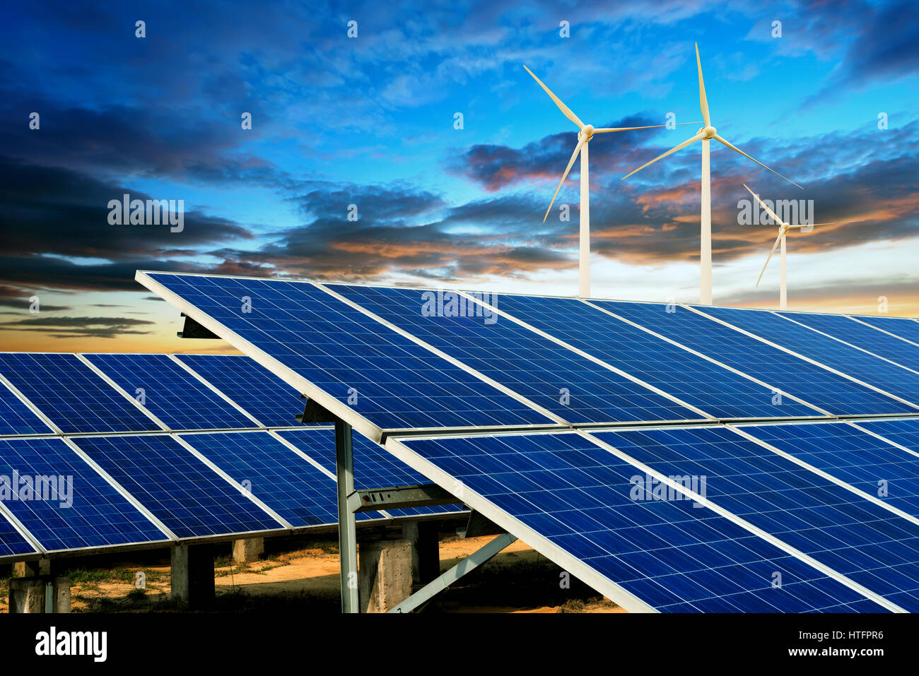 Solar panels in the evening sky backdrop Stock Photo - Alamy