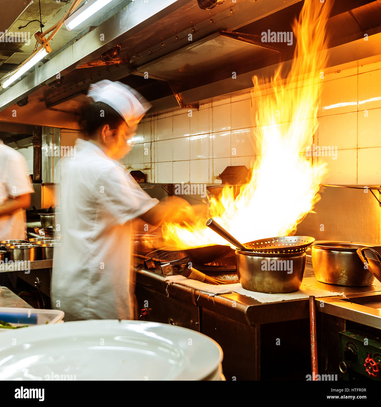 Crowded kitchen, a narrow aisle, working chef Stock Photo - Alamy