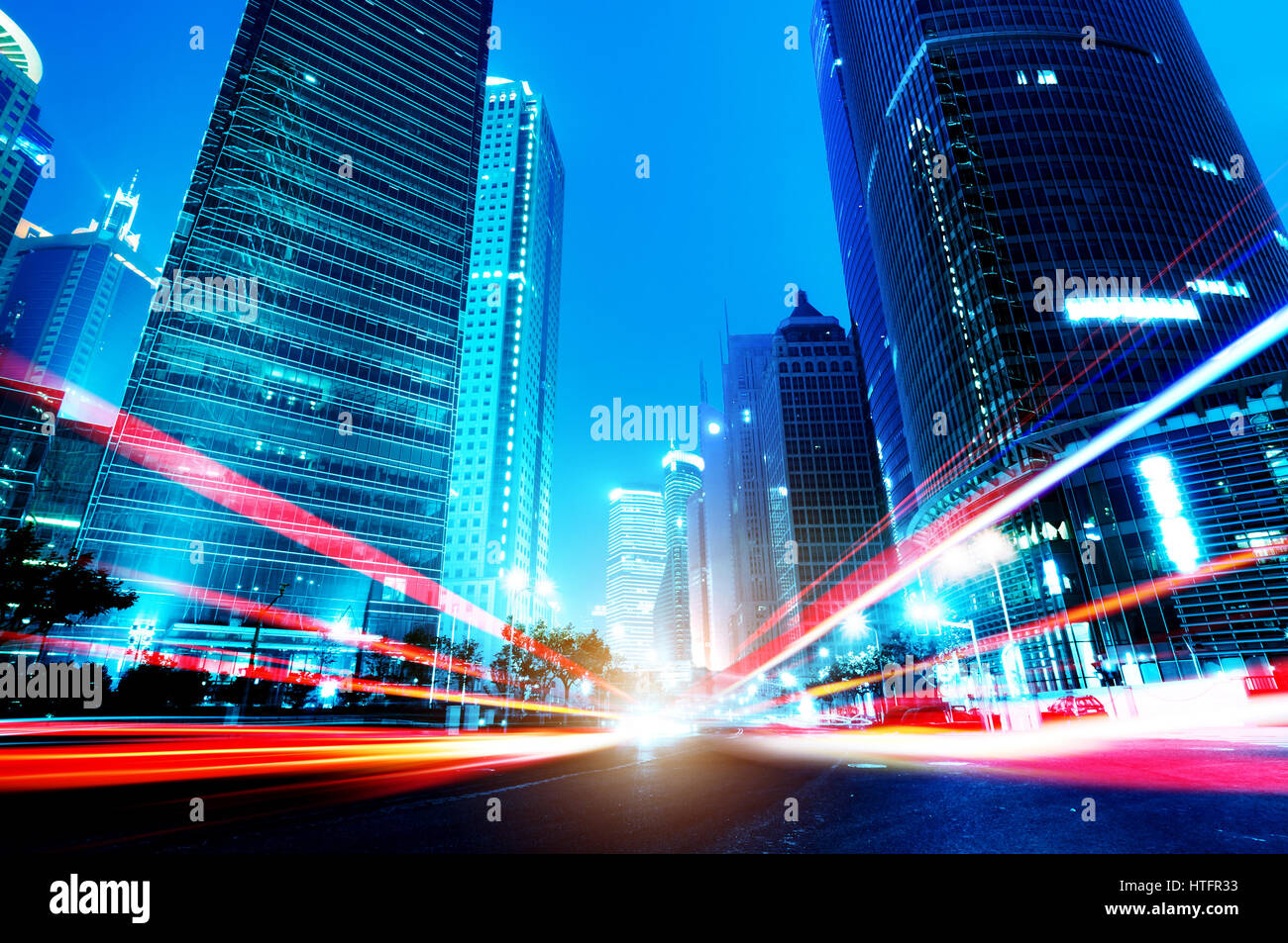 The light trails on the modern building background in shanghai china ...