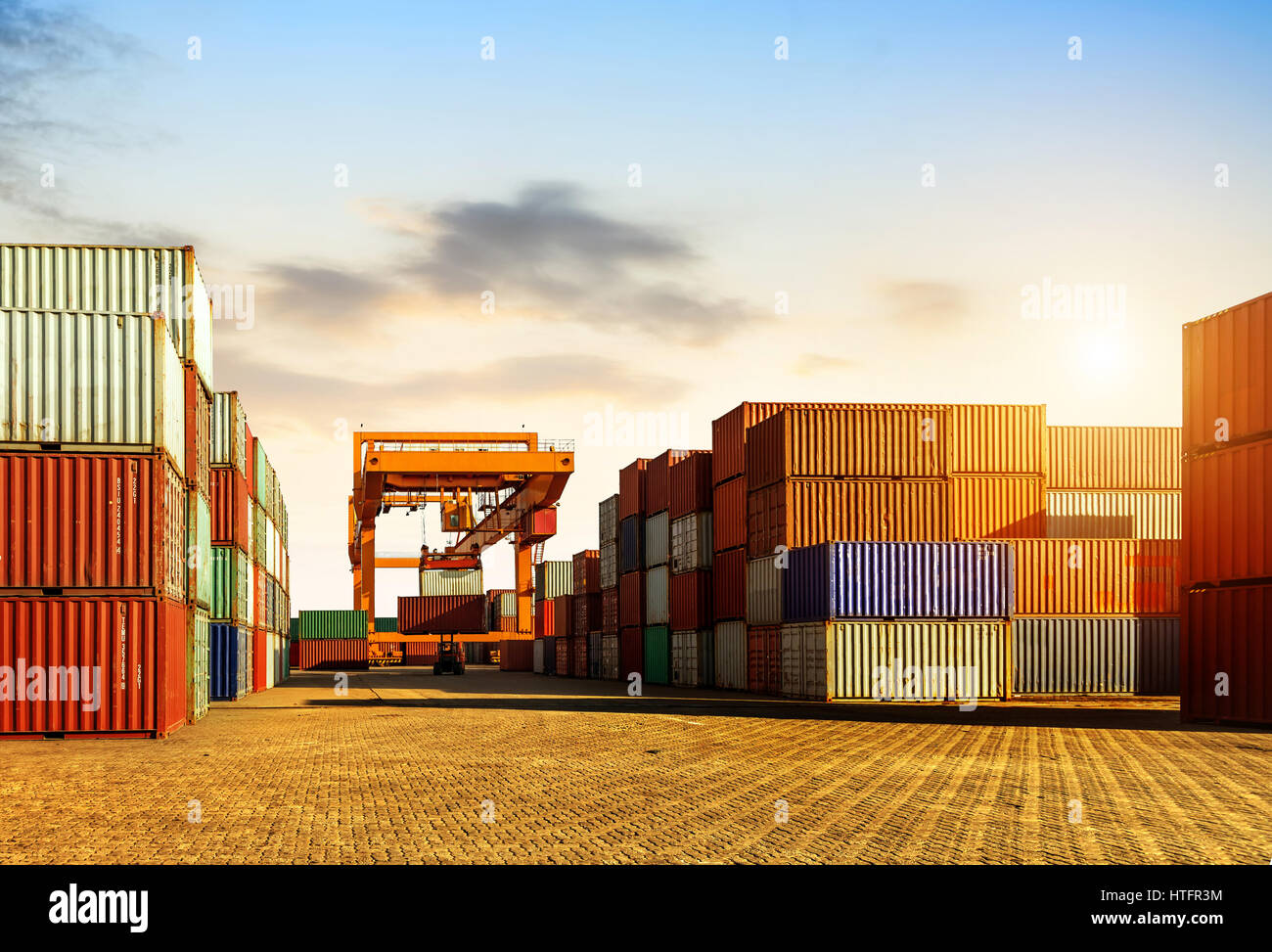 When the container terminal at dusk, work cranes and forklift Stock ...