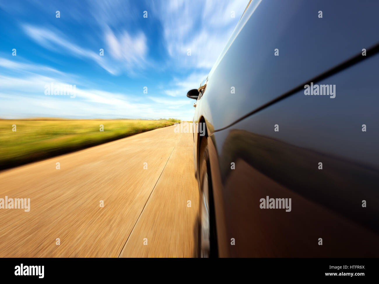 A car driving on a motorway at high speeds, overtaking other cars Stock ...