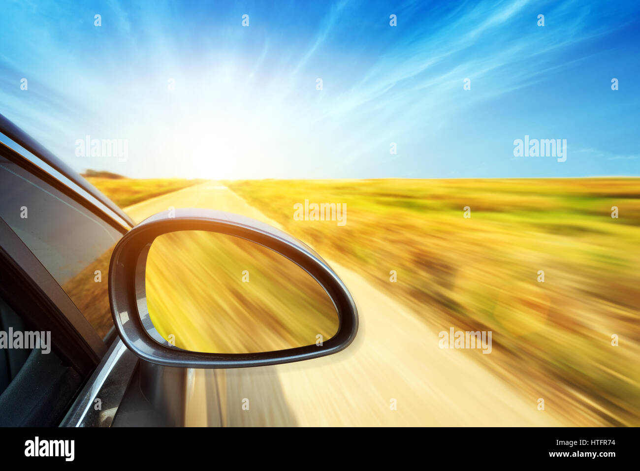 A car driving on a motorway at high speeds, overtaking other cars Stock ...